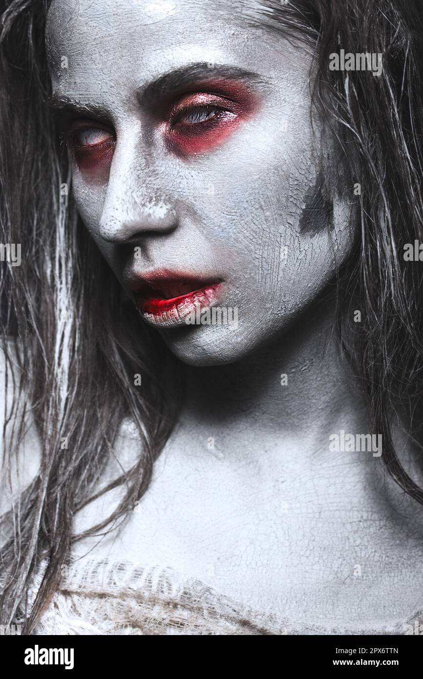 Girl in the form of zombies, Halloween corpse with blood on his lips ...