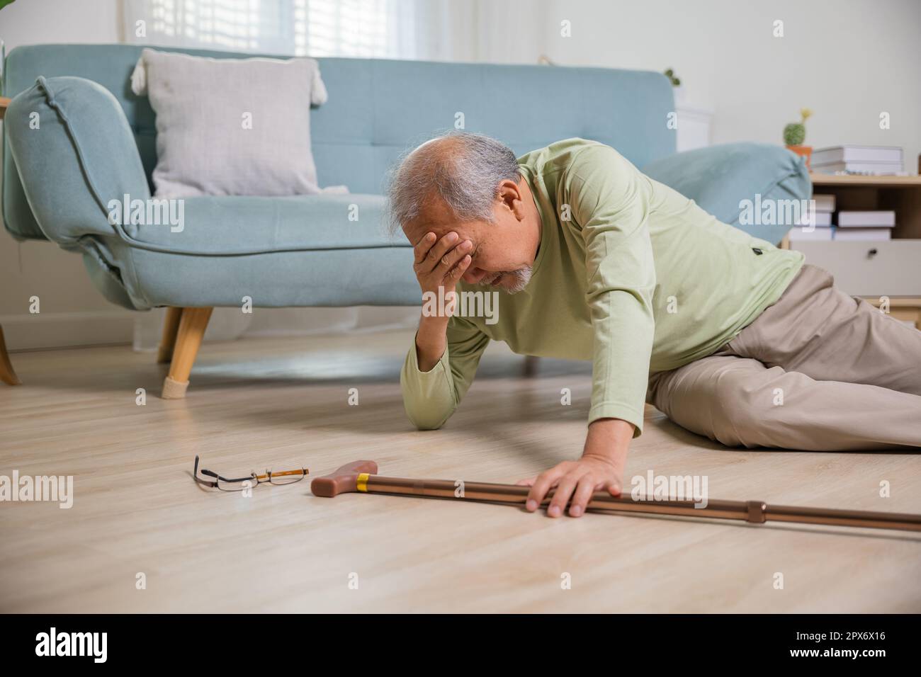 Sick senior old man falling down lying on the ground because stumbled ...