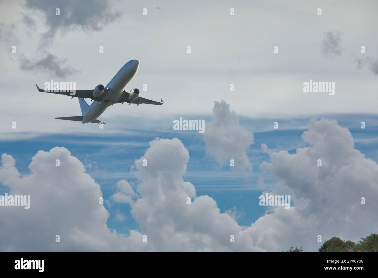 Cloud formations with great plane in the blue summer sky Stock Photo ...