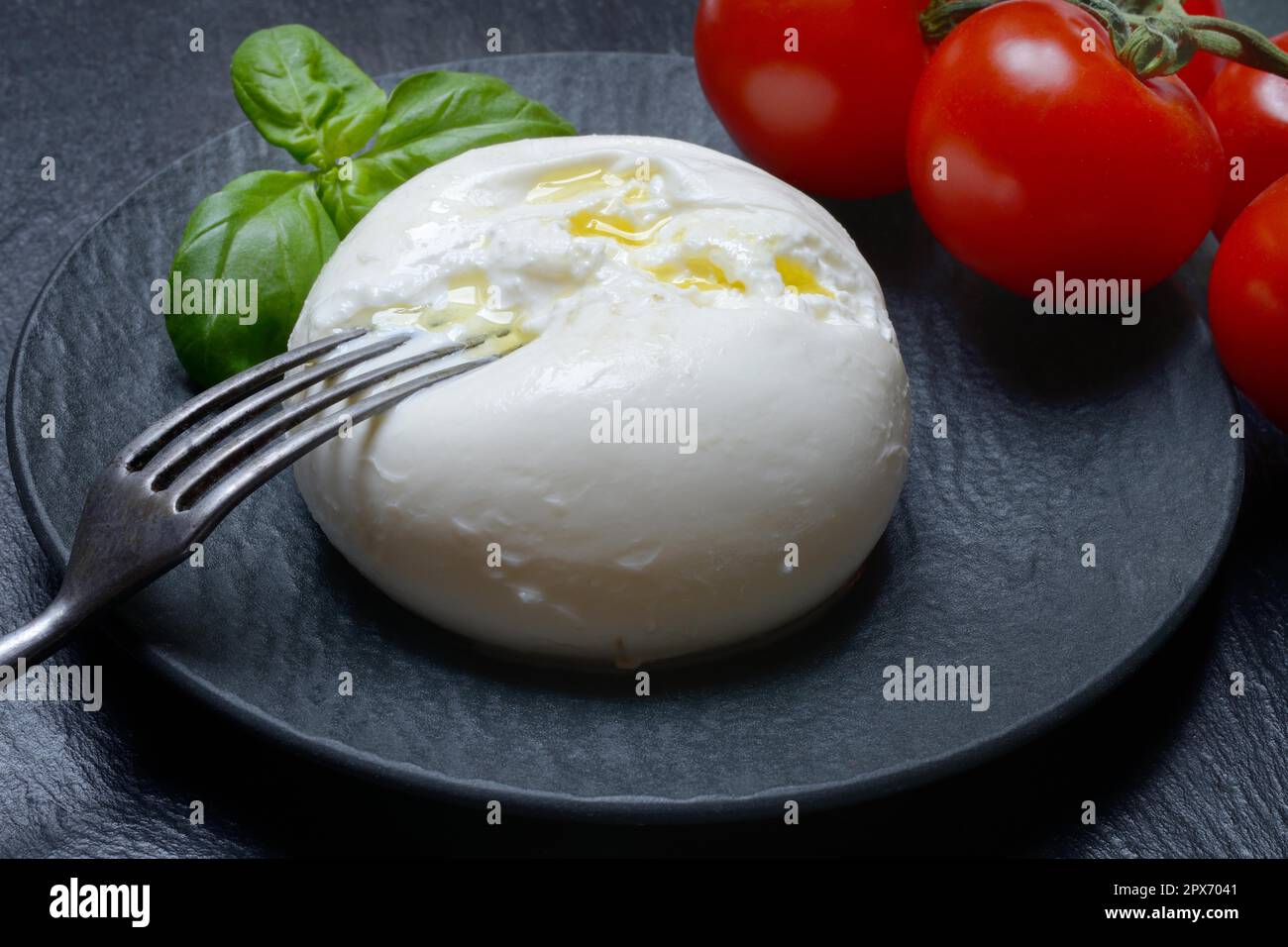 Burrata, burrata cheese with olive oil on plate, fresh cheese from ...