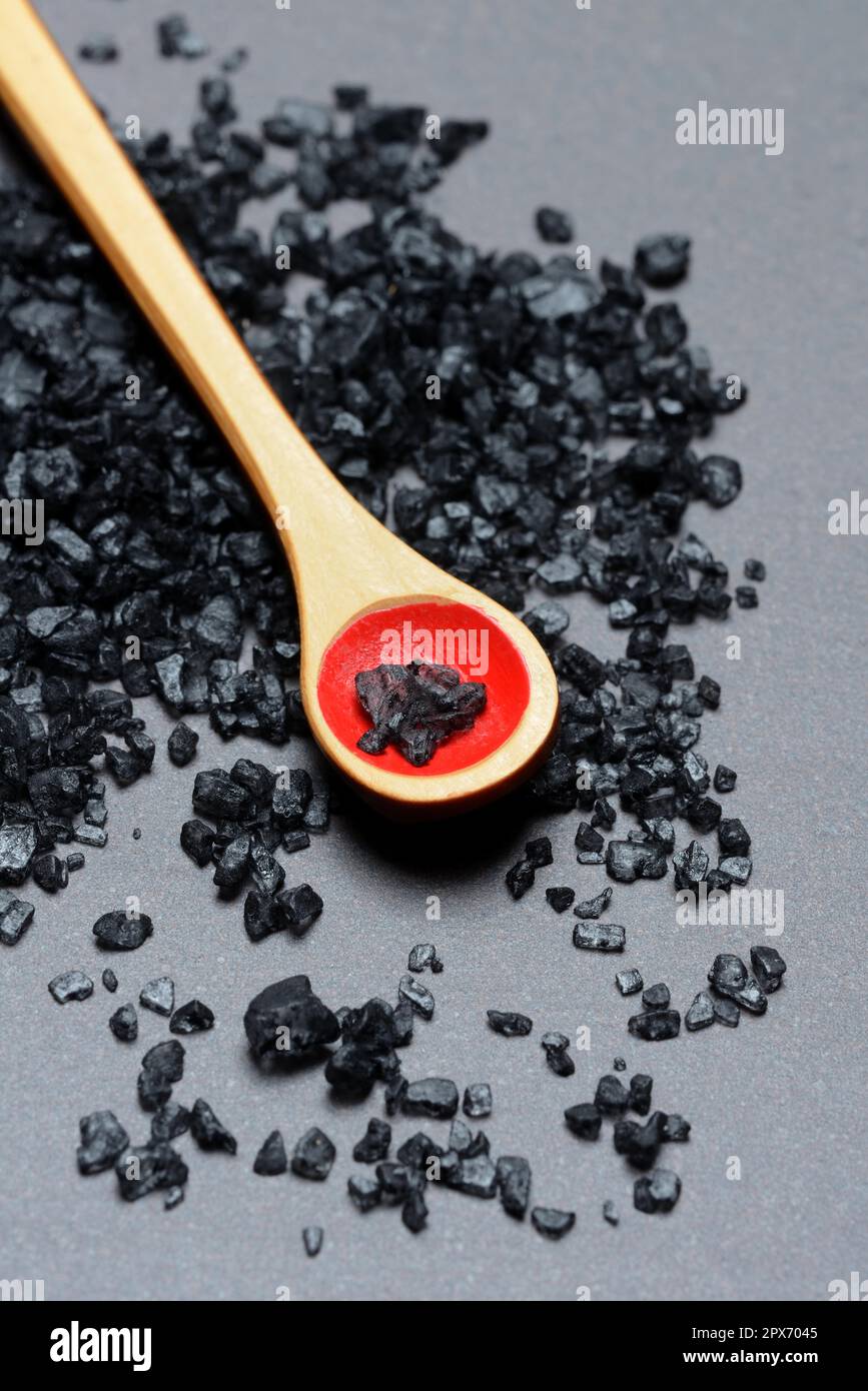 Black Hawaiian salt on spoon, sea salt with activated charcoal Stock ...
