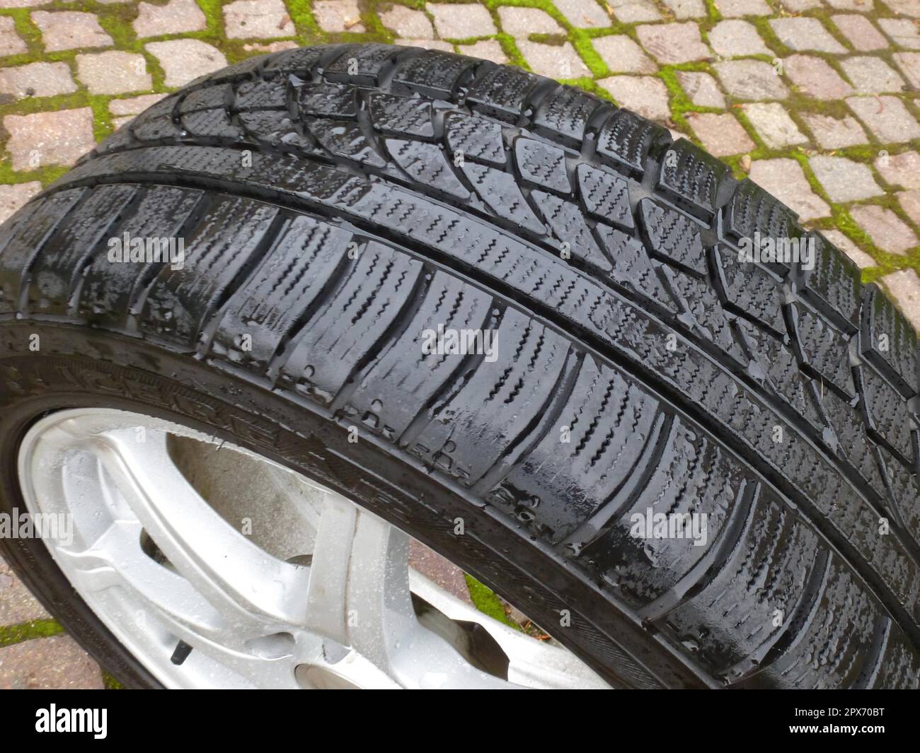 Alloy rim with winter tyres Stock Photo - Alamy