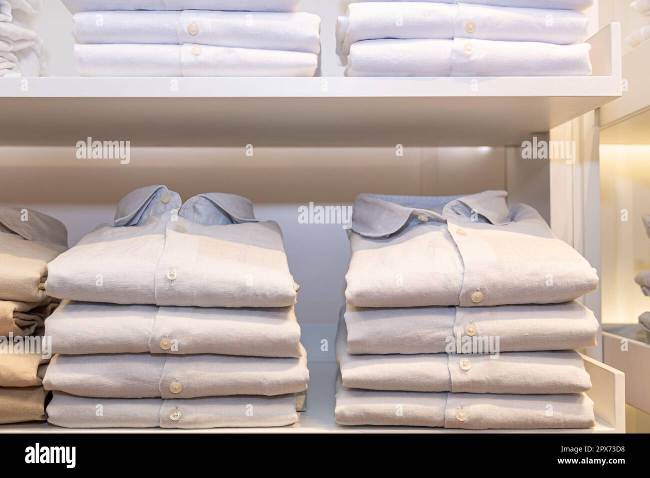 Stack folded clothes in shelf hi-res stock photography and images - Alamy