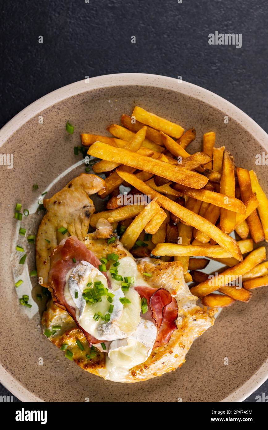 typical czech cuisine chicken slice baked with ham and camembert with ...