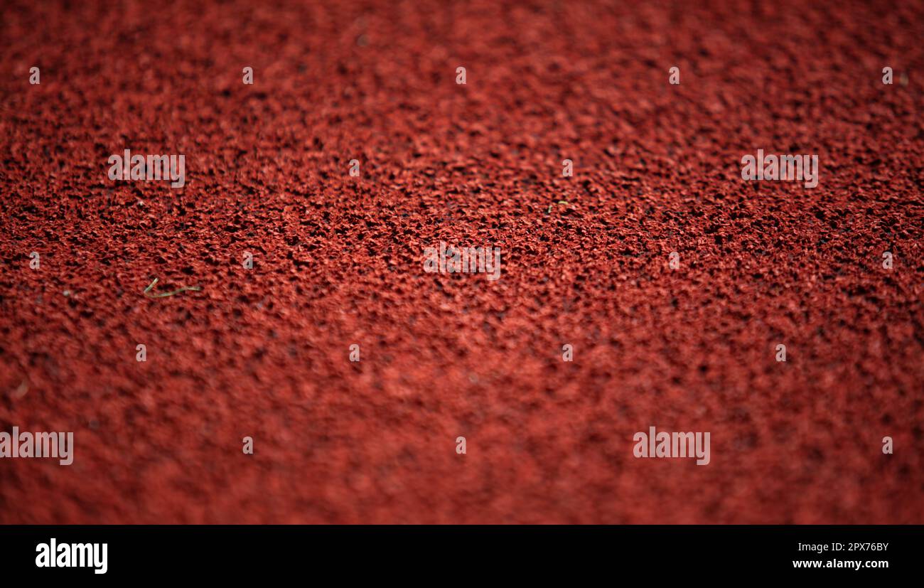 Closeup of running track, red textured surface for design purpose Stock ...