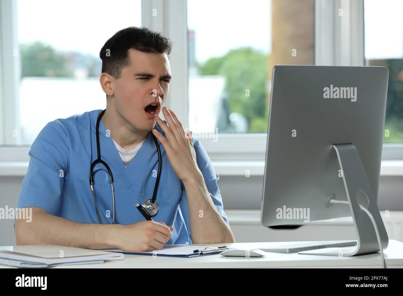 Doctor yawning hi-res stock photography and images - Alamy