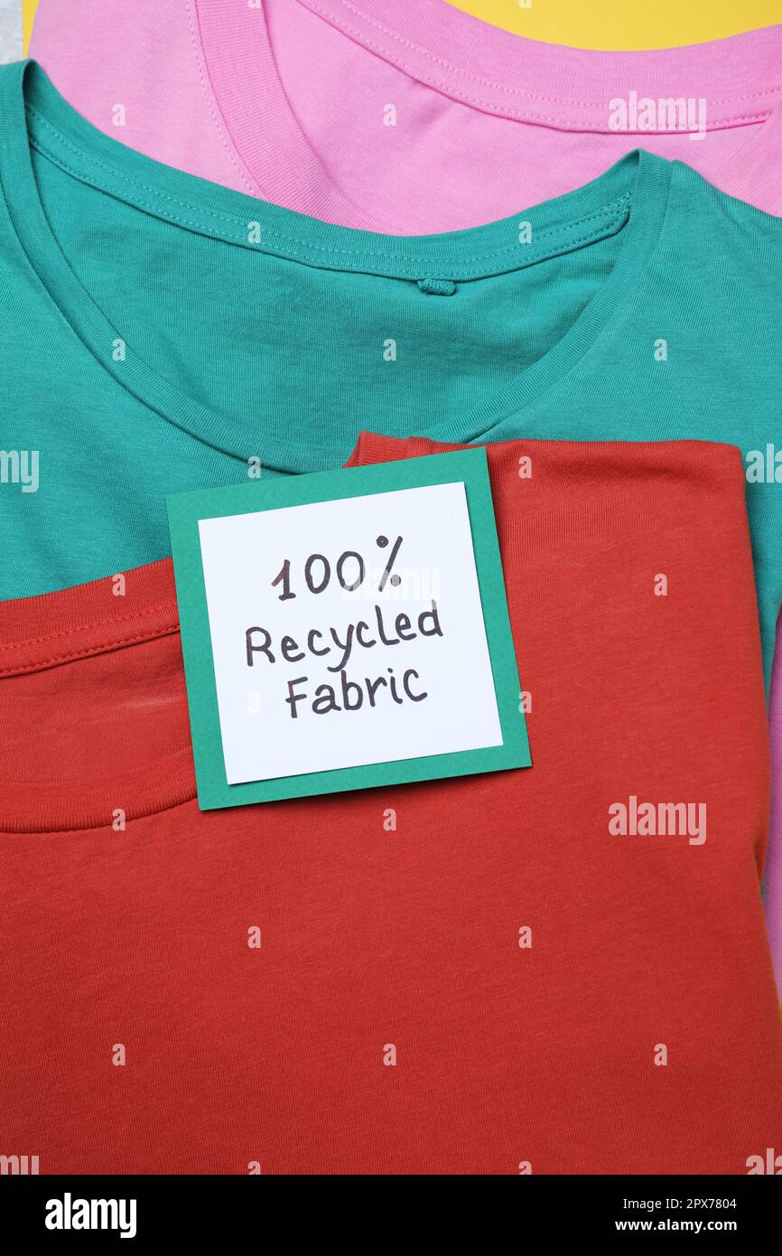 Different clothes with recycling label, closeup view Stock Photo - Alamy