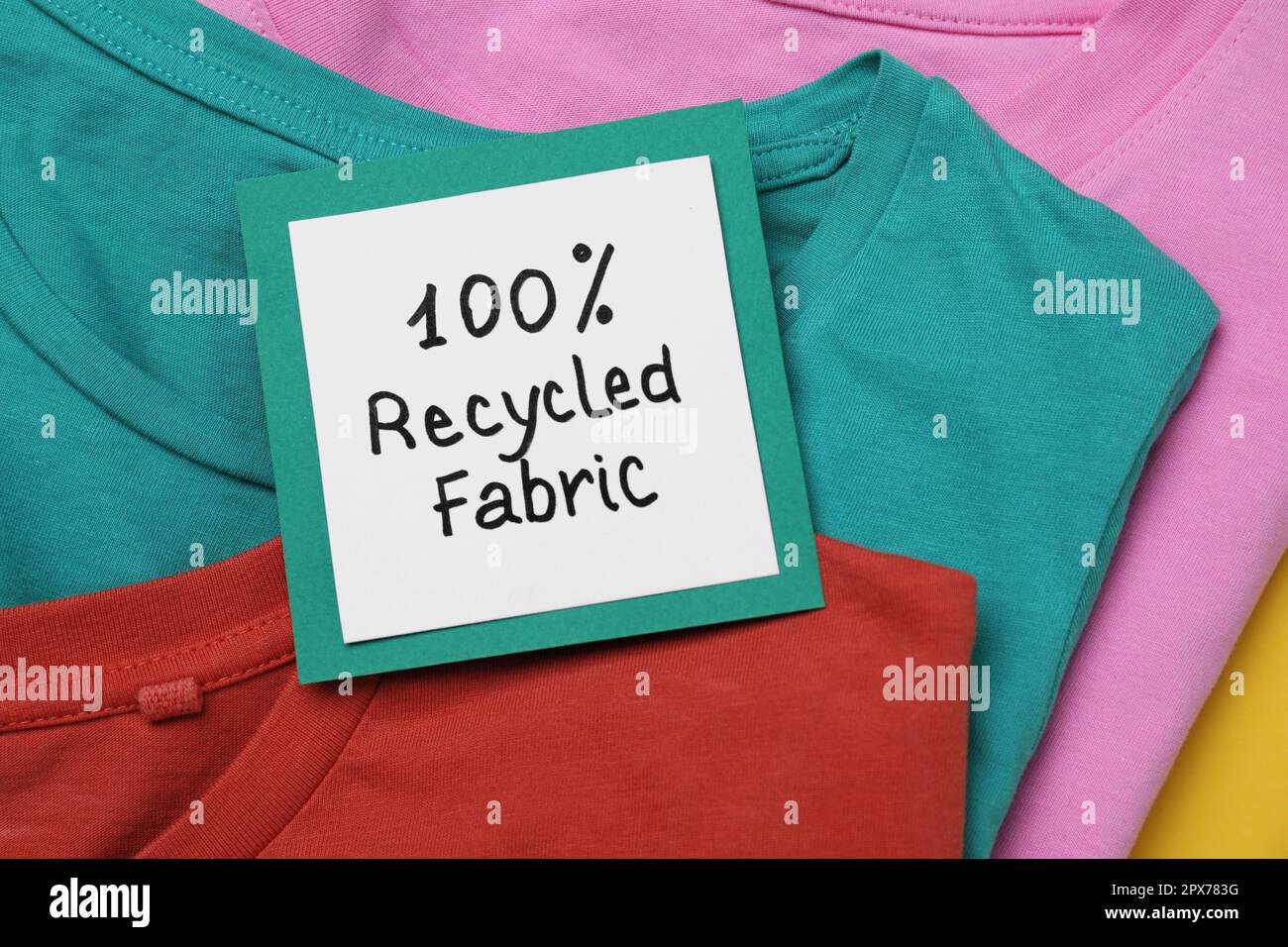 Different clothes with recycling label, closeup view Stock Photo - Alamy