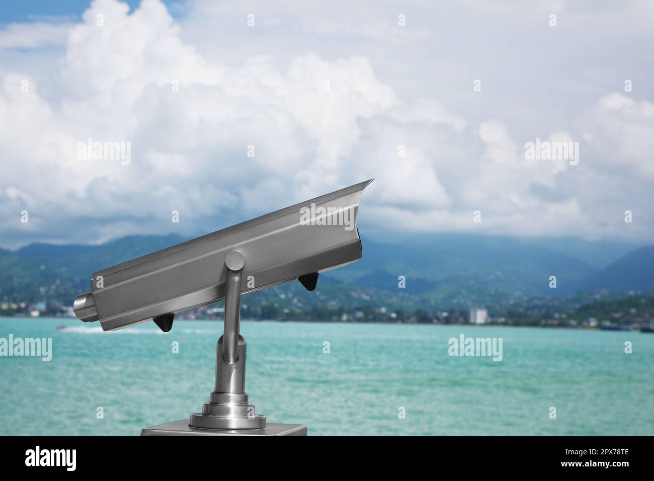 Metal tower viewer installed near sea, space for text. Mounted ...