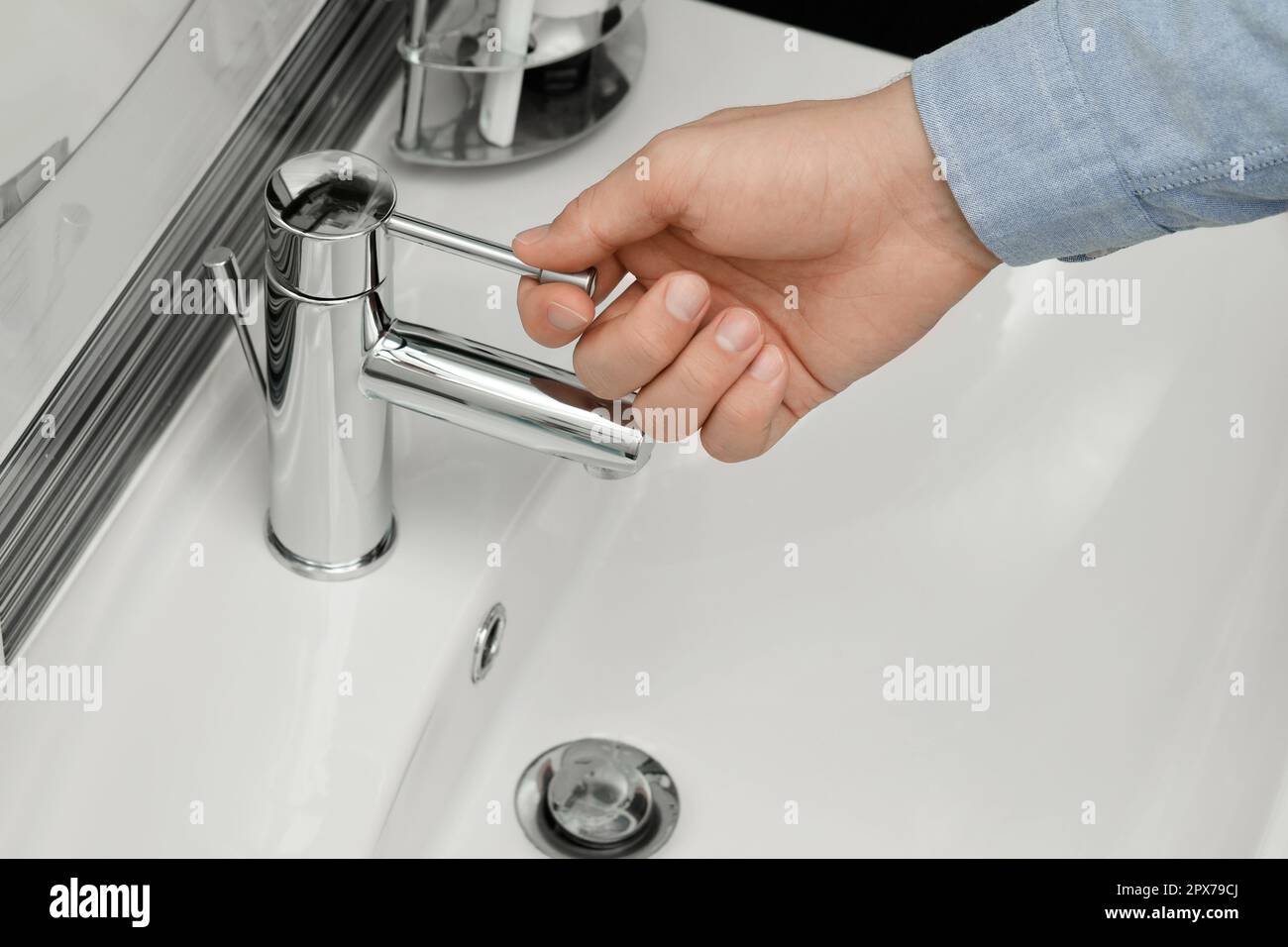 Hand man using tap hi-res stock photography and images - Alamy