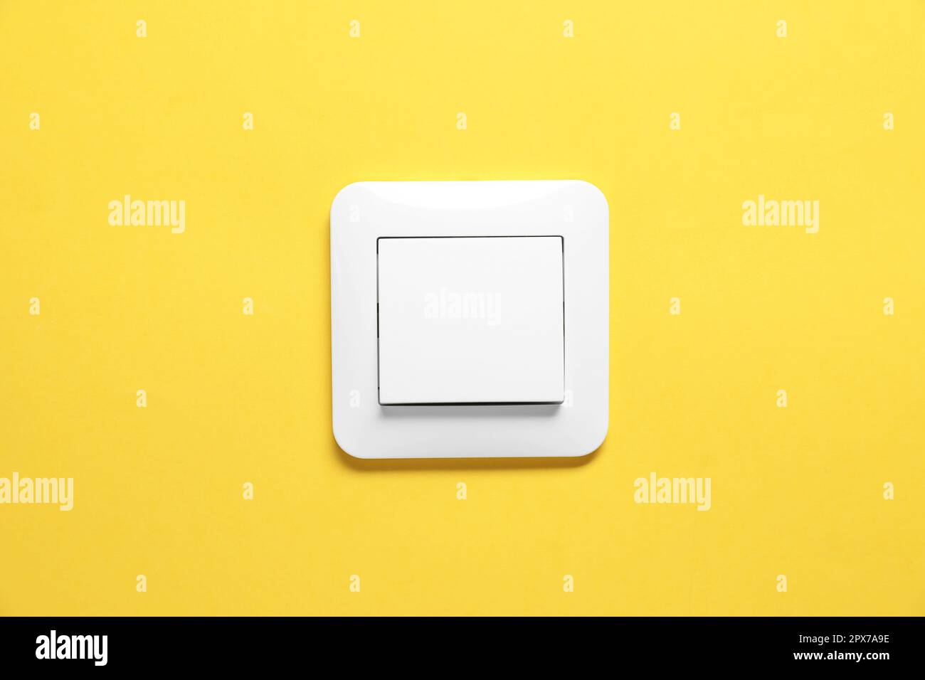 Modern plastic light switch on orange background Stock Photo - Alamy