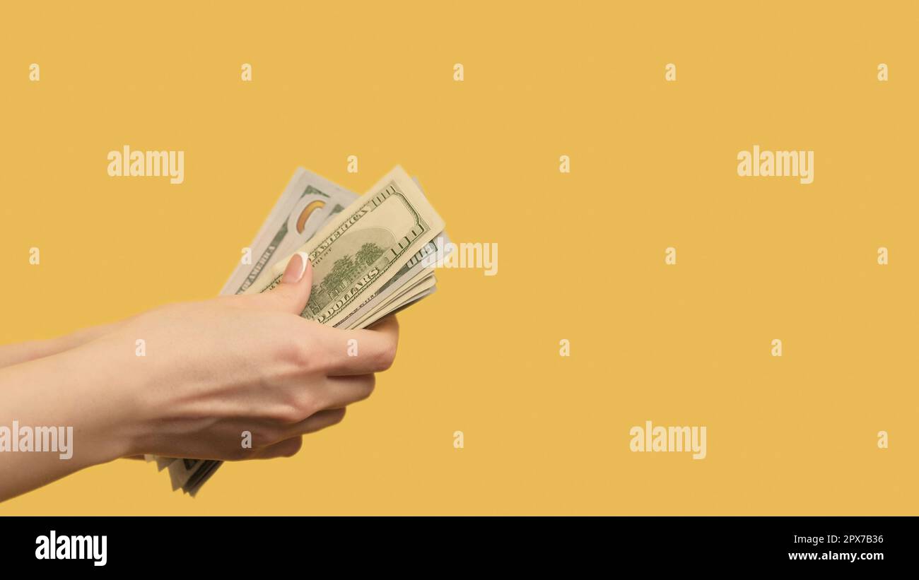 Savings account hand gesture counting dollars Stock Photo - Alamy