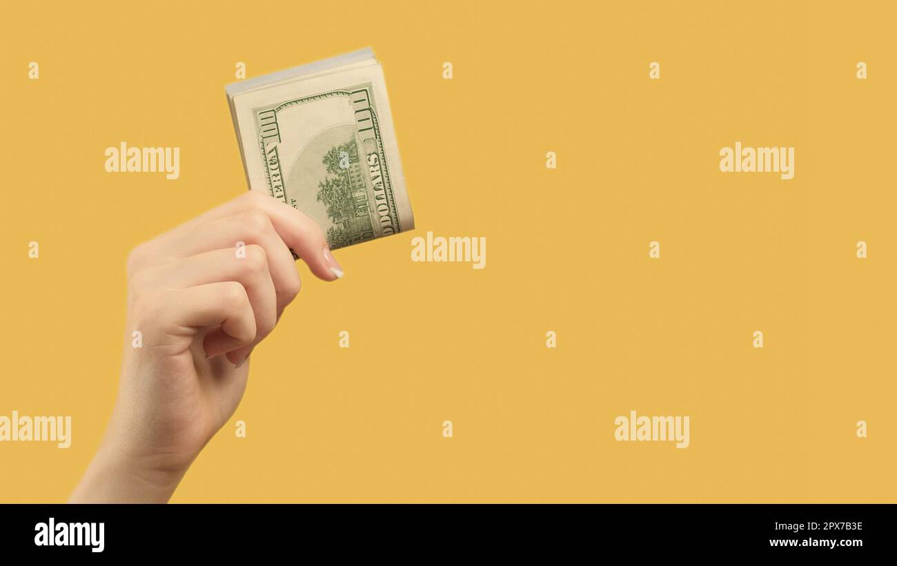 Investment income money loan hand gesture dollars Stock Photo - Alamy