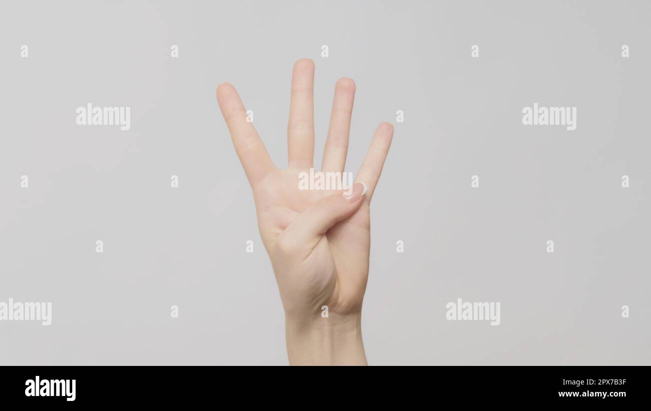 Hand gesture four number woman showing fingers Stock Photo - Alamy