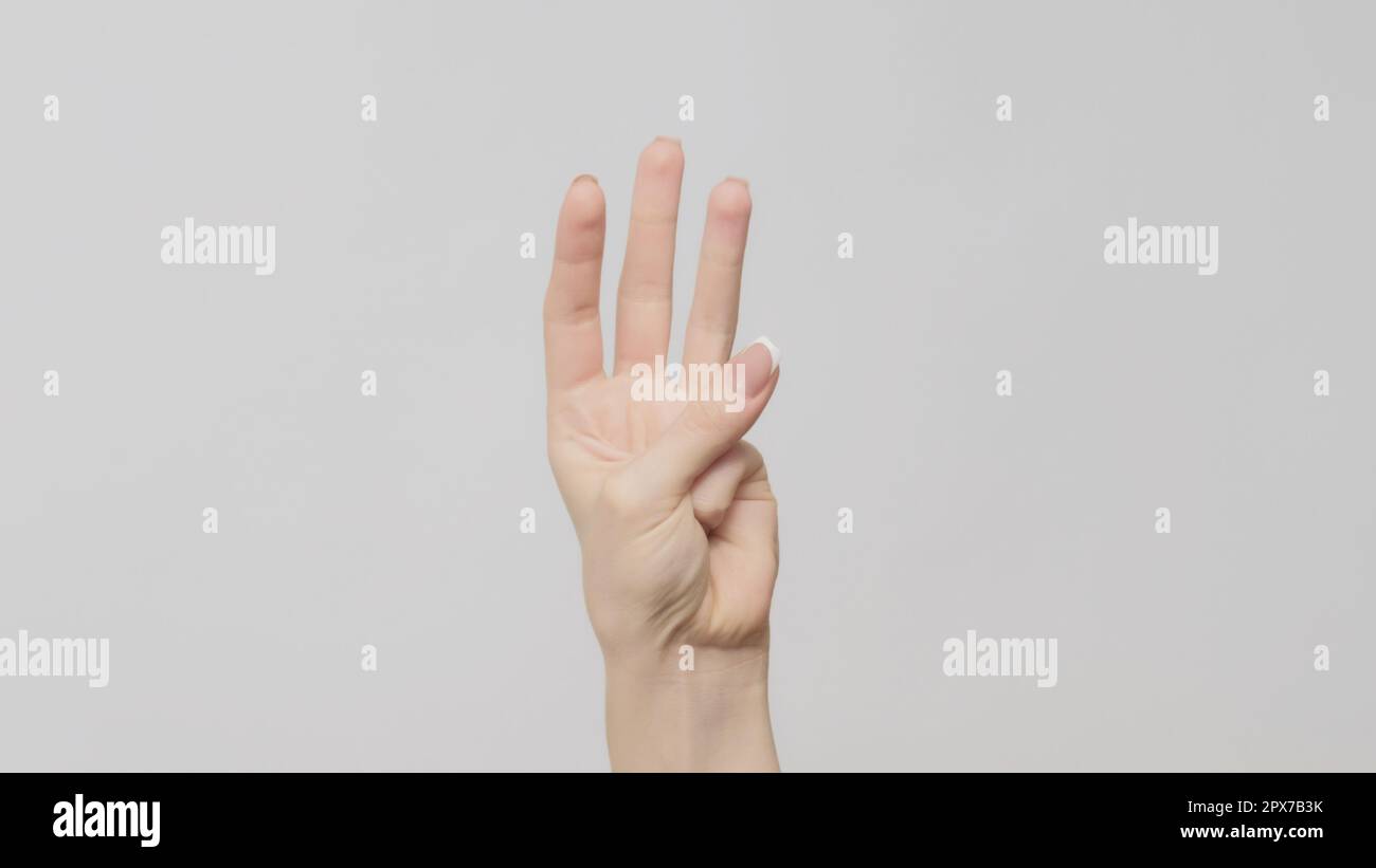 Hand gesture three number woman showing fingers Stock Photo - Alamy