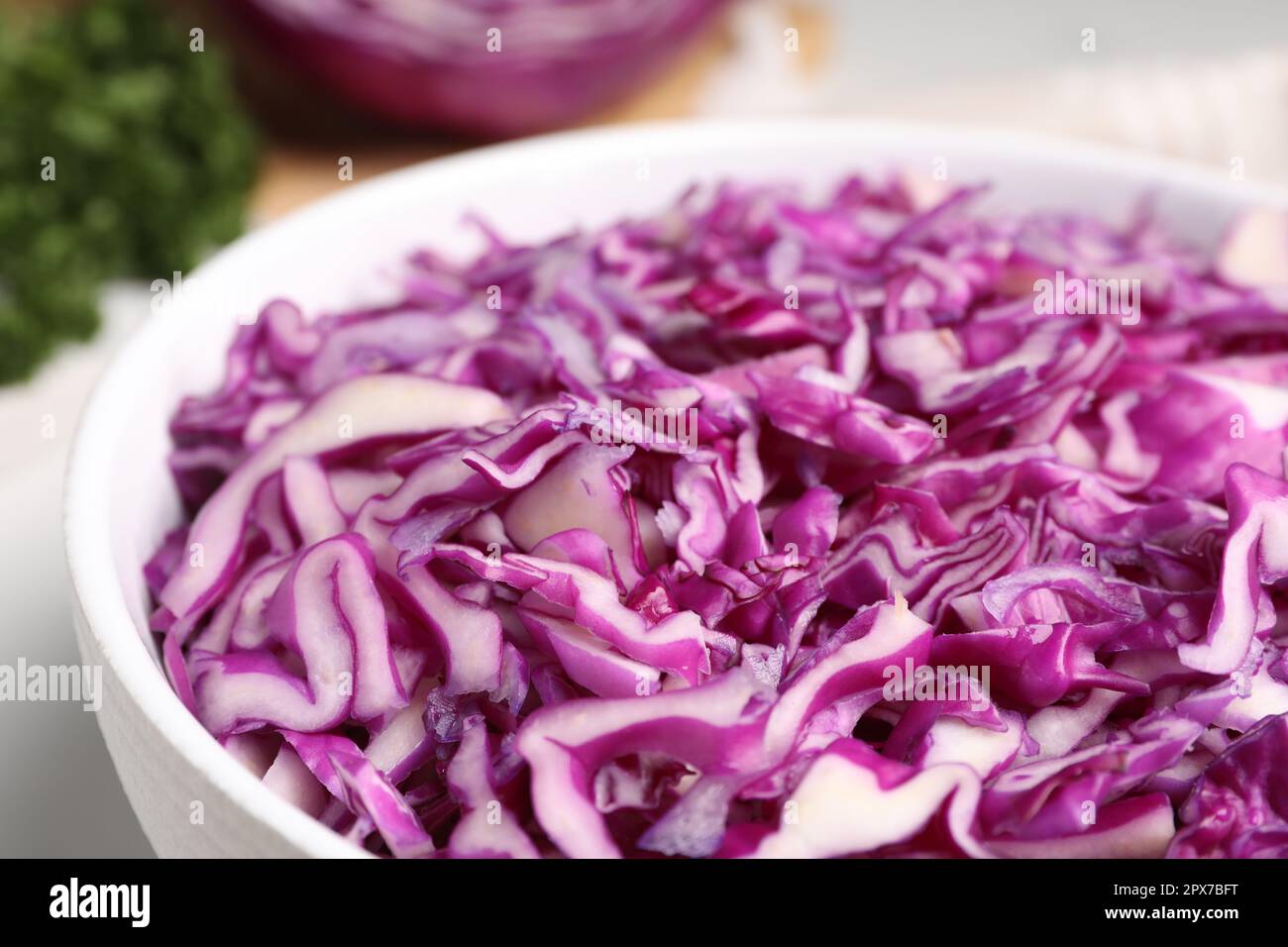 Bowl with shredded red cabbage, closeup view Stock Photo - Alamy