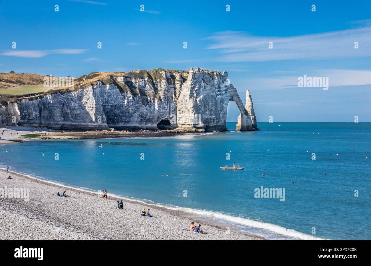 beach of Étretat with view of the 70m-high chalk cliff of Falaise d ...