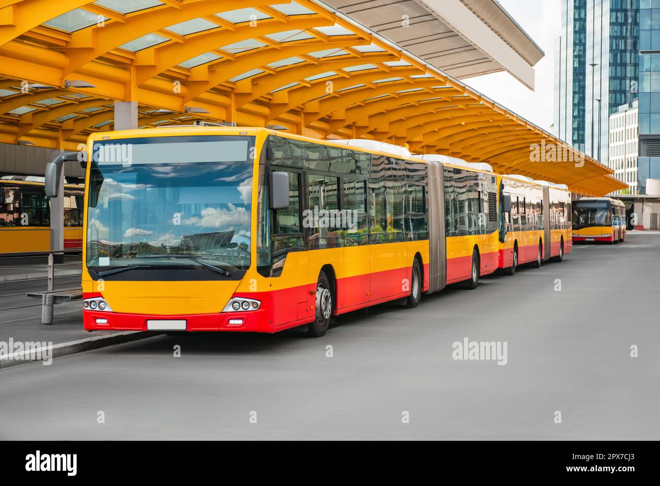 Modern bus near stop on sunny day. Public transport Stock Photo - Alamy
