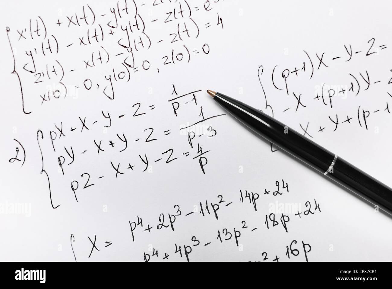 Sheet of paper with mathematical formulas and pen, top view Stock Photo ...