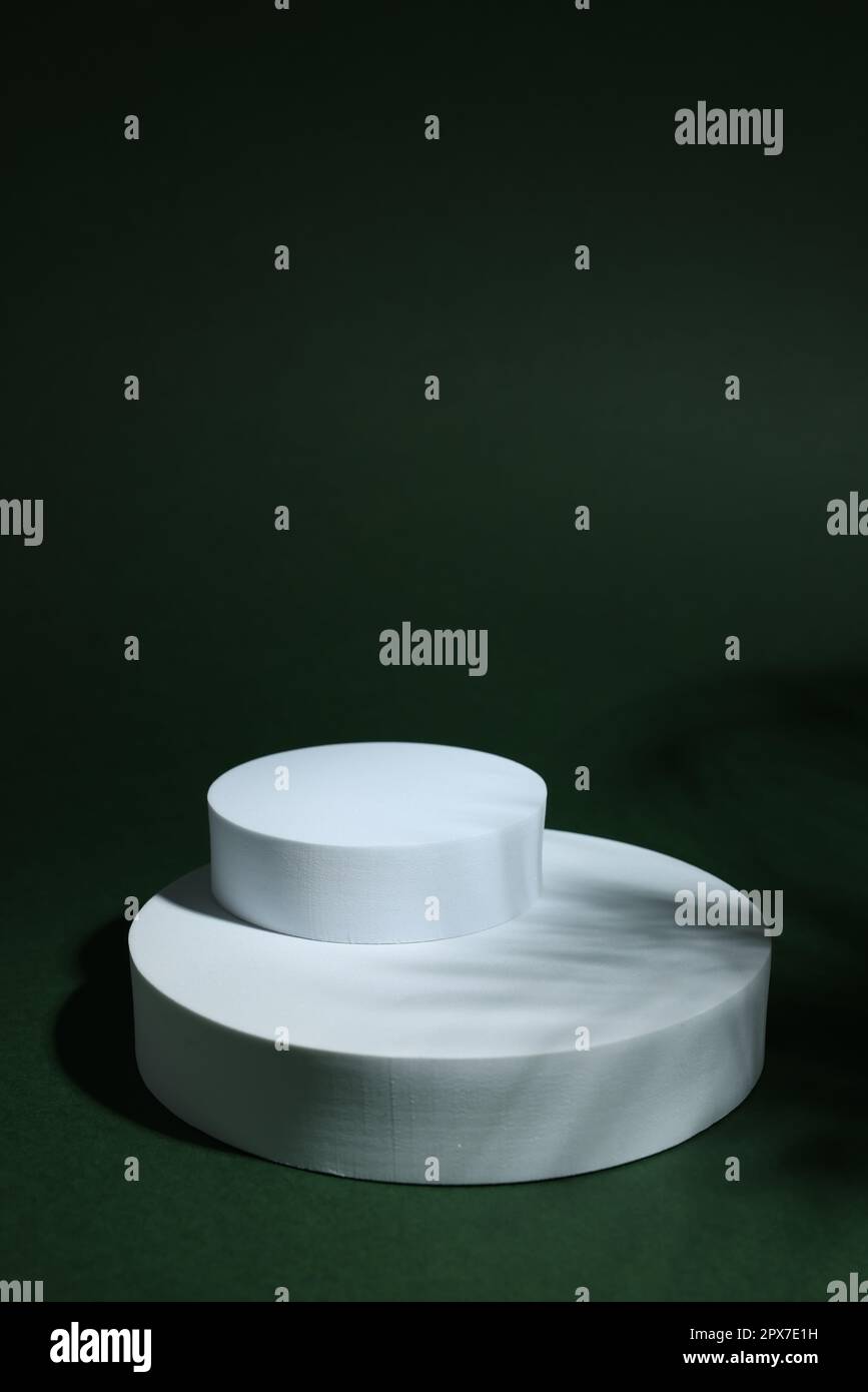 Product photography props. Round shaped podiums on green background ...