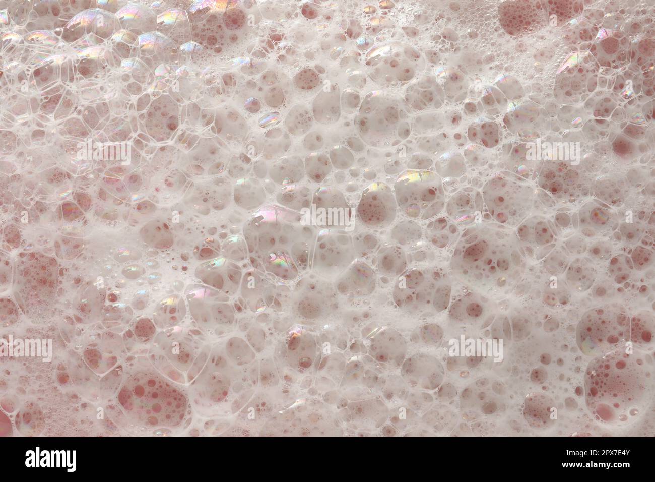 White washing foam on pale pink background, top view Stock Photo - Alamy