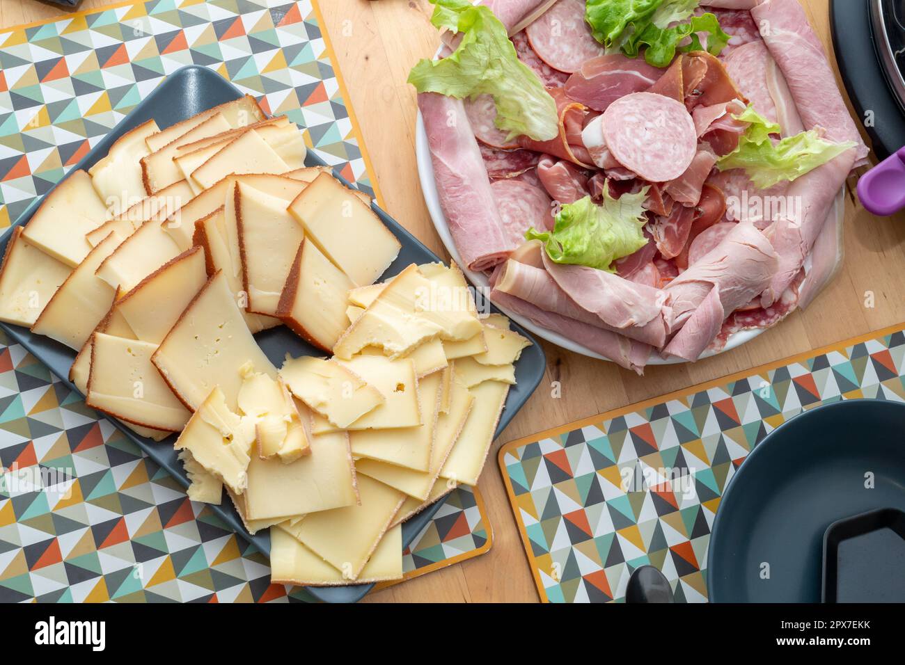 Raclette cheese and meat, a french tradition Stock Photo - Alamy