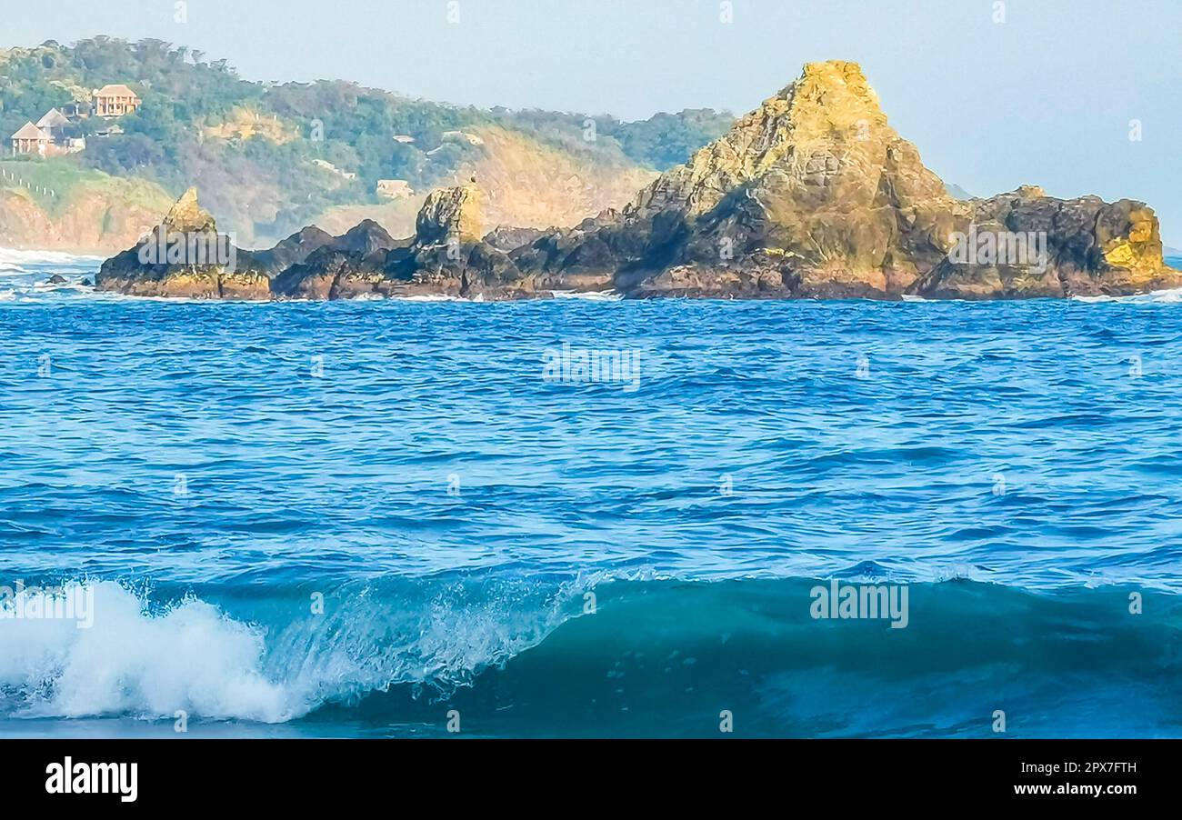 Beautiful paradise beach with mountains cliffs rocks high waves and ...