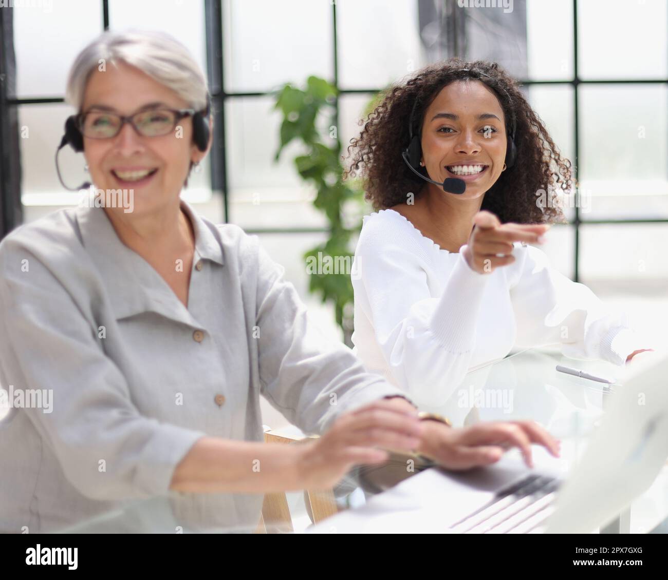 Female customer service agent in a call center Stock Photo - Alamy