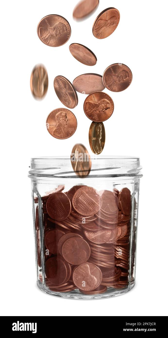 Coins falling into glass jar on white background Stock Photo - Alamy