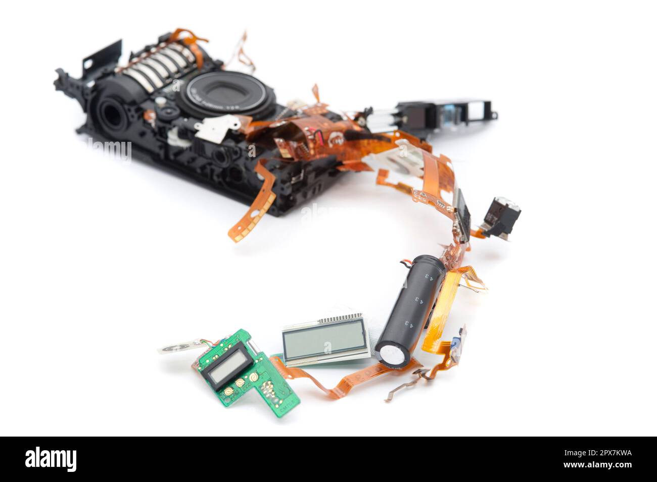 Disassembled old compact 35mm film camera with the inner components and ...