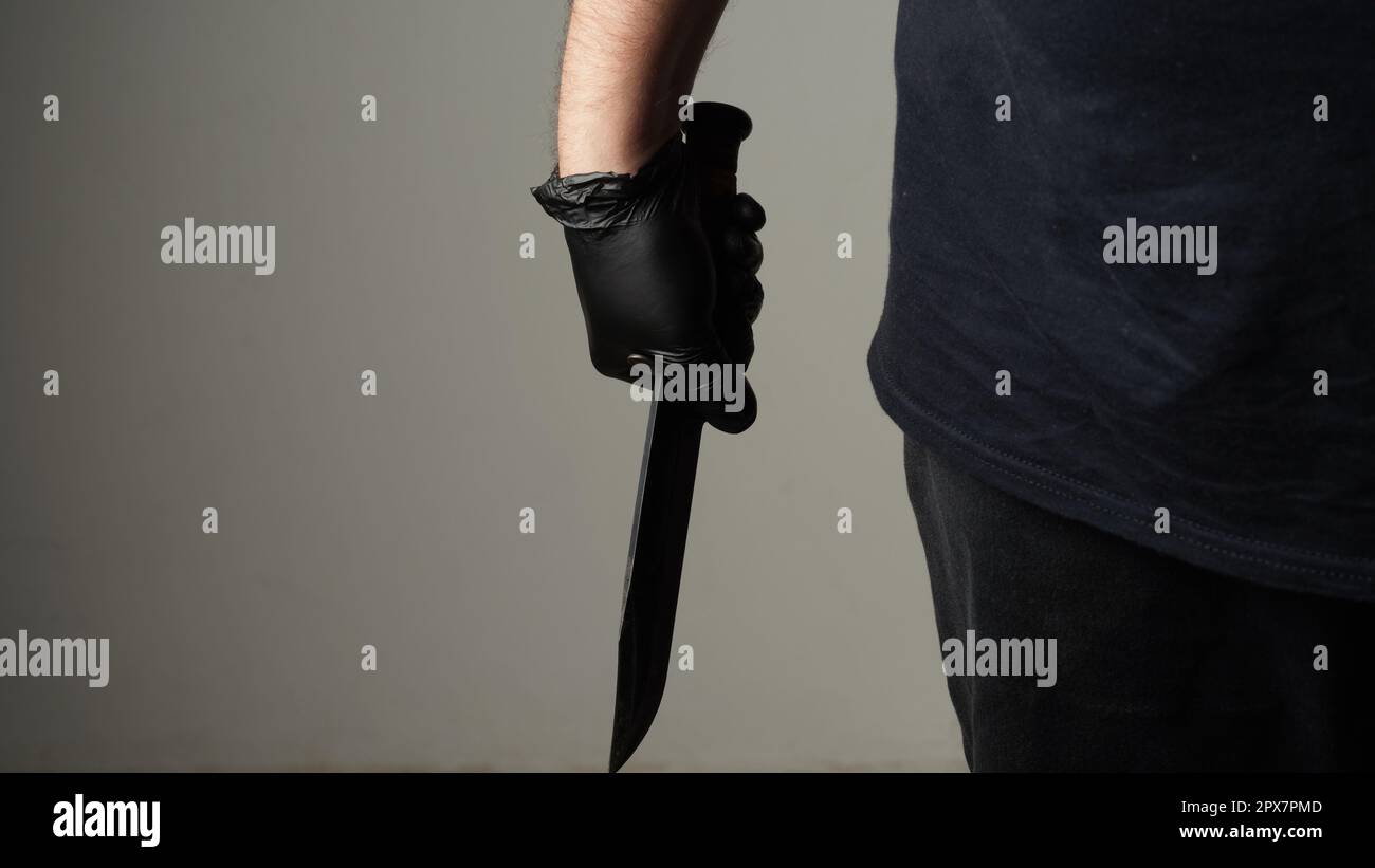 The man with a Combat tactical stainless steel fighting knife in a hand ...