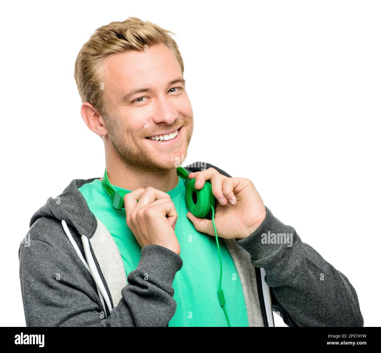 Music comes first. a handsome young man standing alone in the studio ...
