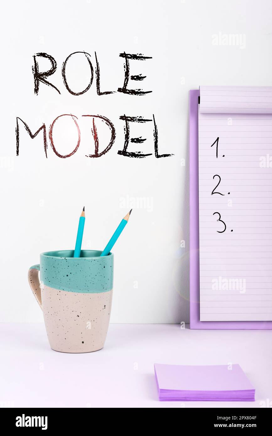 Text sign showing Role Model, Business approach a person looked to by ...