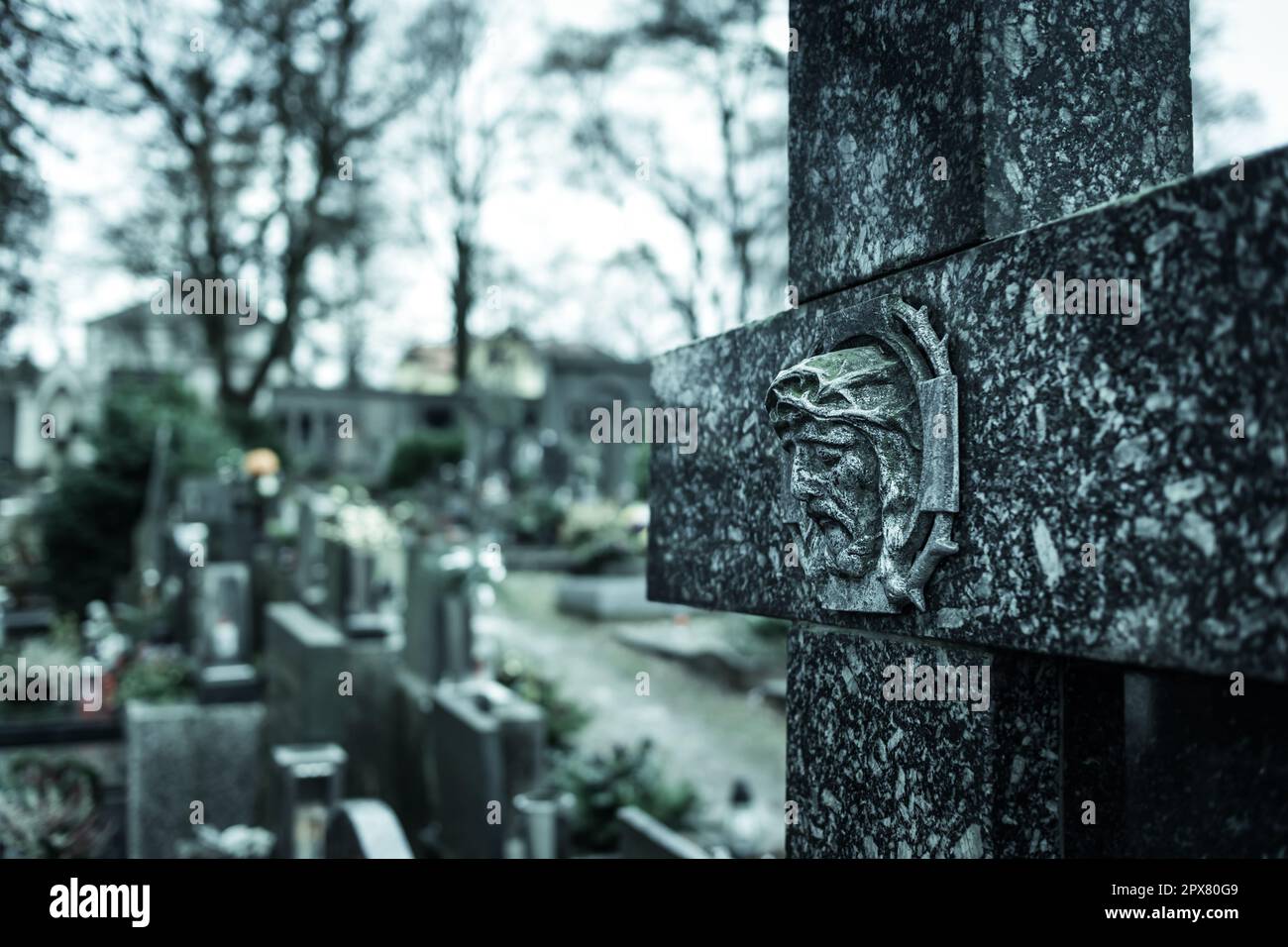 Marble cross in cemetery. Tomb decoration. Memorizing loved ones ...