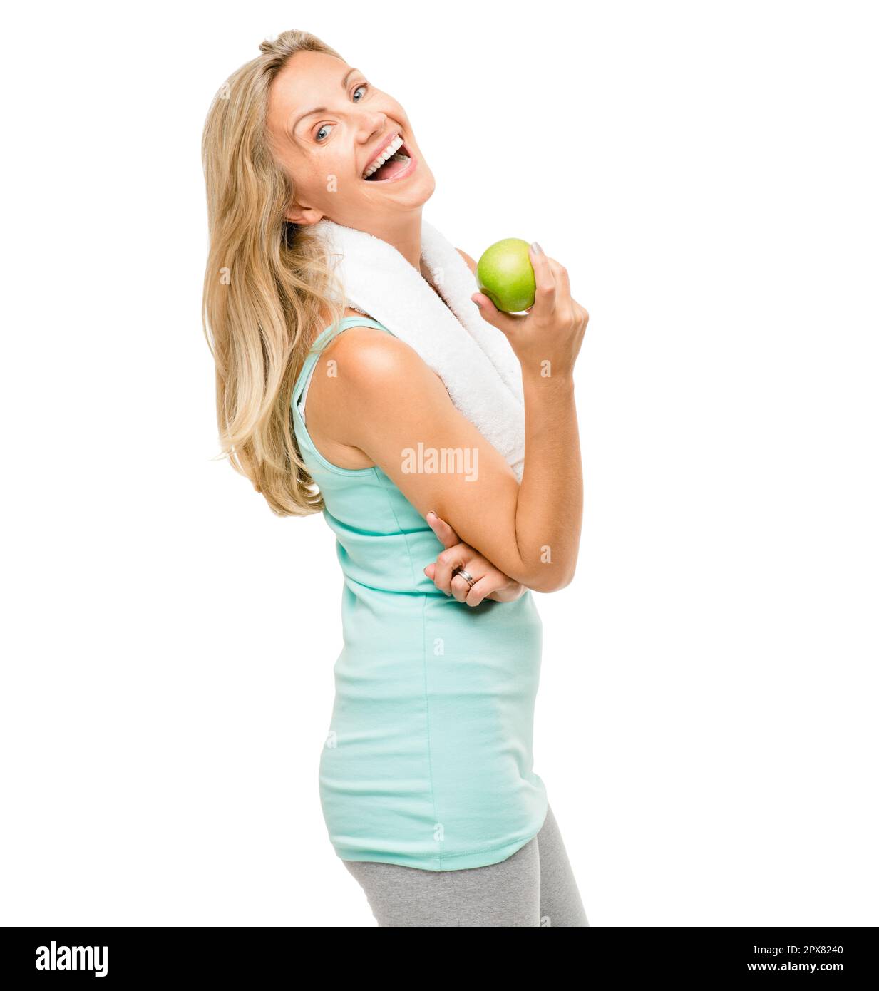 Laughing her way to a svelte figure. a mature woman eating an apple ...