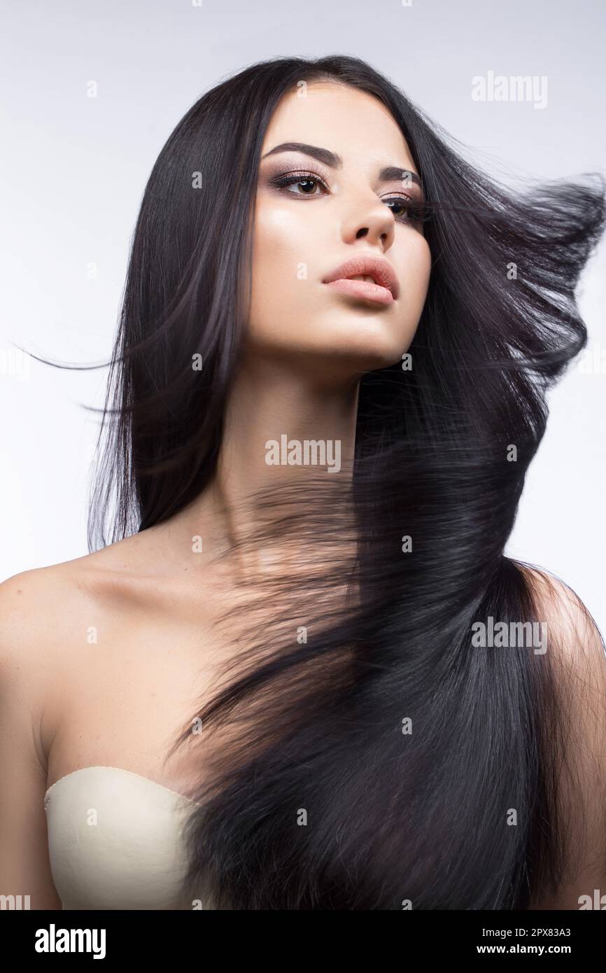 Beautiful brunette girl in move with a perfectly smooth hair, and ...