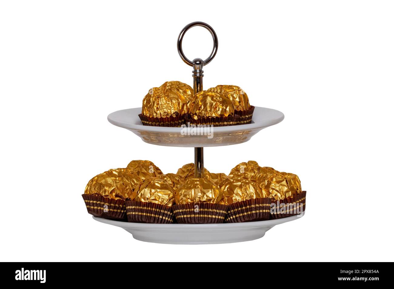 Pastries, desserts and sweets. Chocolate candies wrapped in golden foil ...