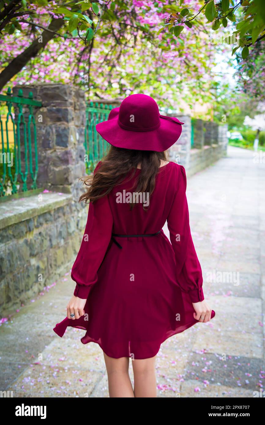girl in red dress and hat - rear view Stock Photo - Alamy