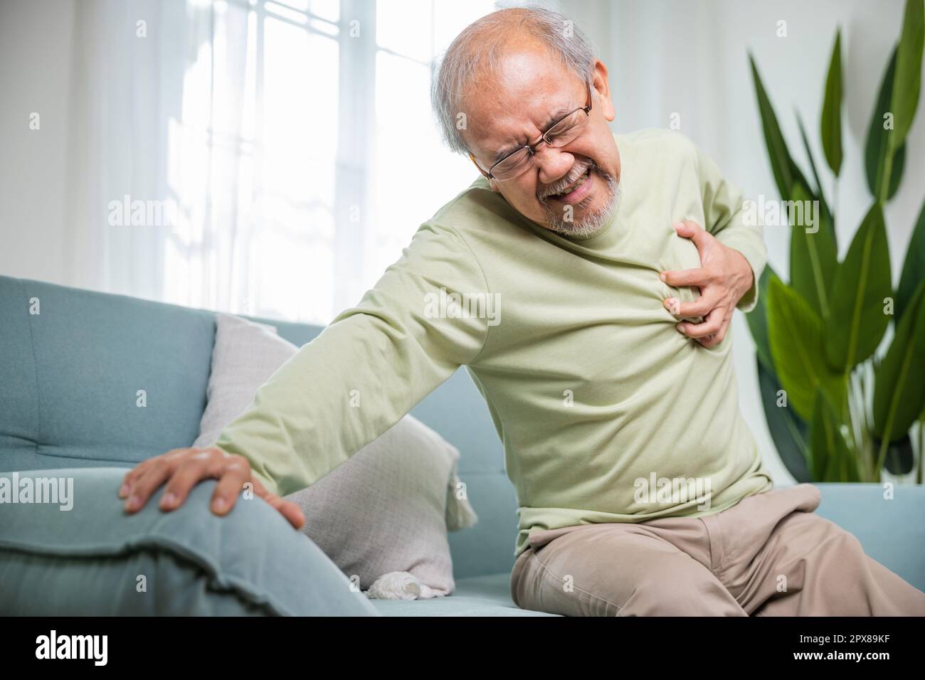 Senior man bad pain hand touching chest having heart attack, Asian ...