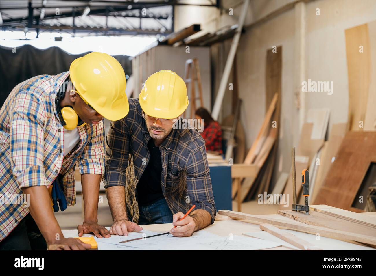 Two carpenter man wear helmet meeting planning job together at ...