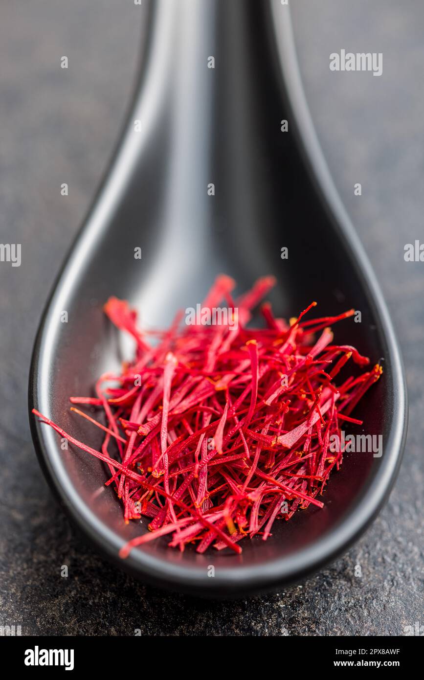 Dried saffron spice in the spoon Stock Photo - Alamy