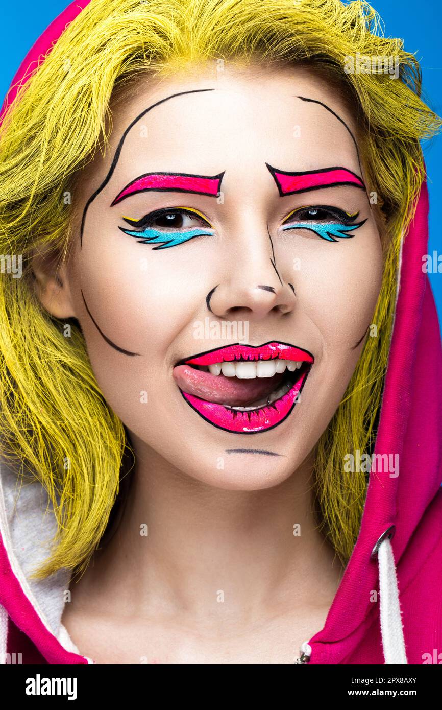 Photo of surprised young woman with professional comic pop art make-up ...