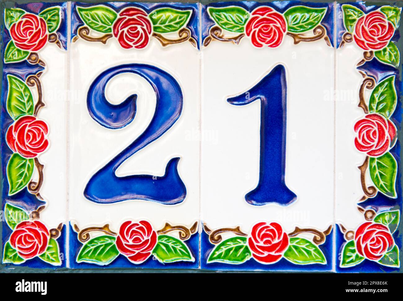 Close up of a house number 21 on enameled colorful tiles with ...