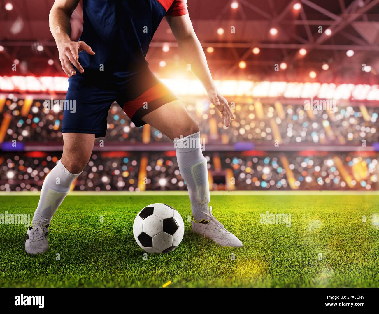 Football player ready to kick the soccerball at stadium Stock Photo - Alamy