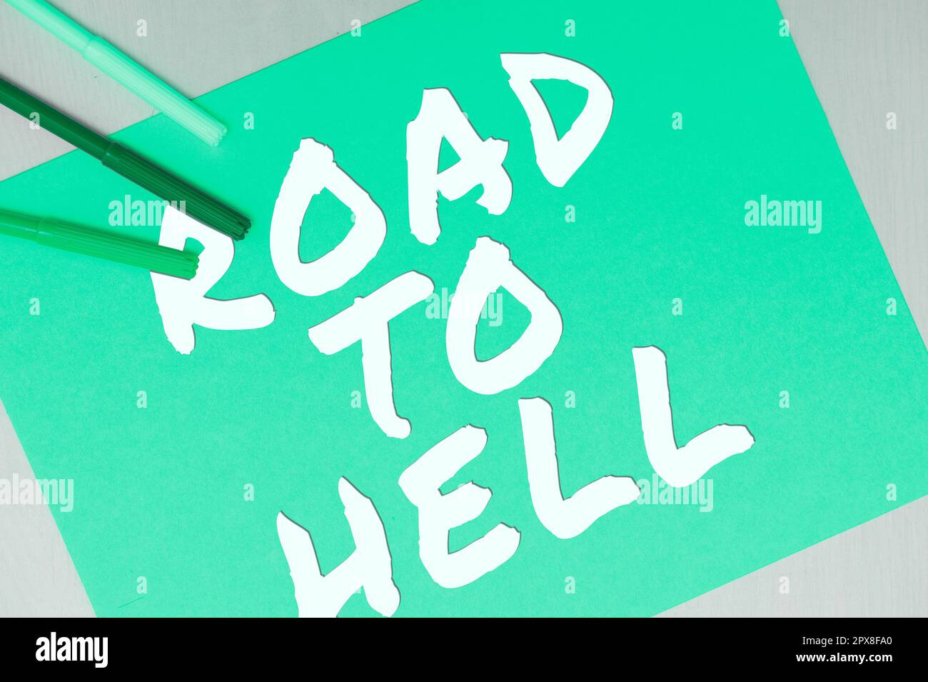 Hand writing sign Road To Hell, Business idea Extremely dangerous ...