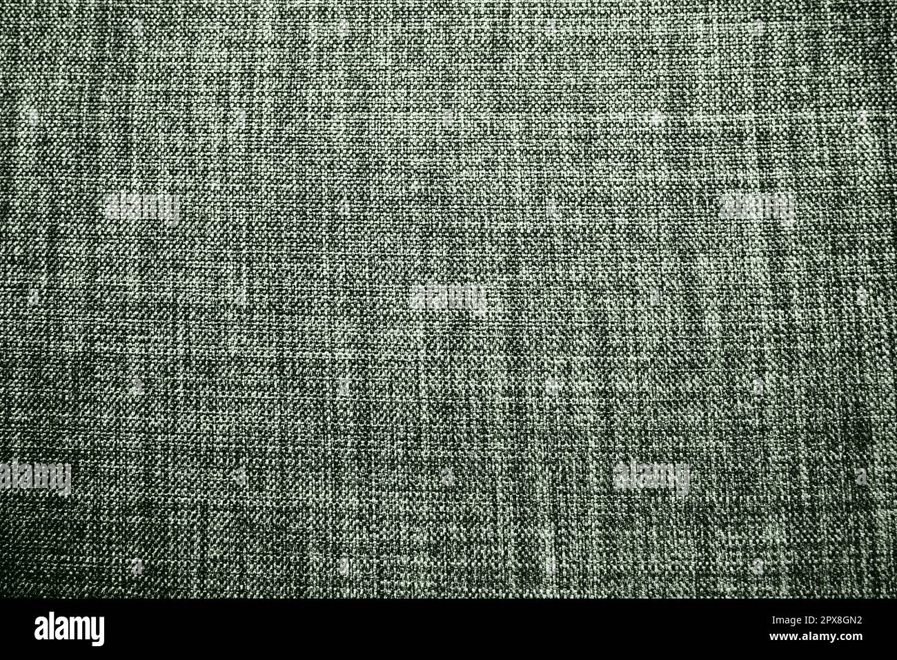 green background fabric texture. A piece of woolen cloth is neatly laid ...