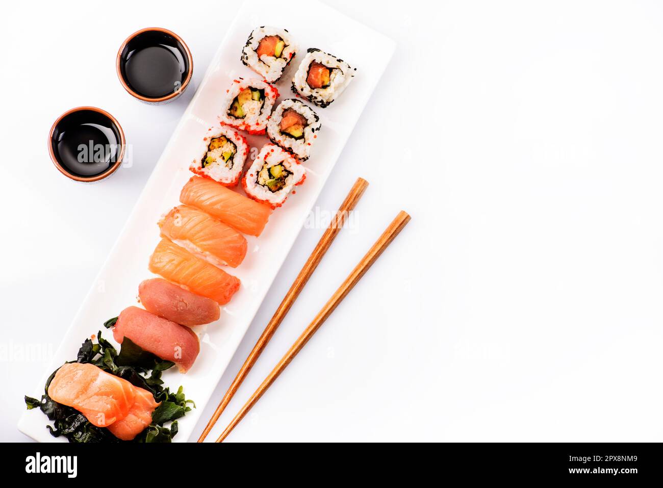 Sushi rolls set with salmon and tuna fish isolated on white background ...