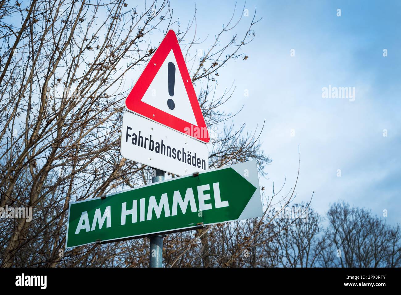 Warning sign on a road Stock Photo - Alamy