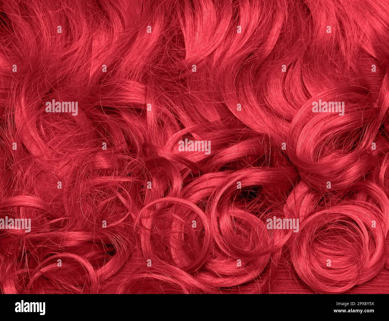 Fiery red female dyed hair with curly waves texture background Stock ...