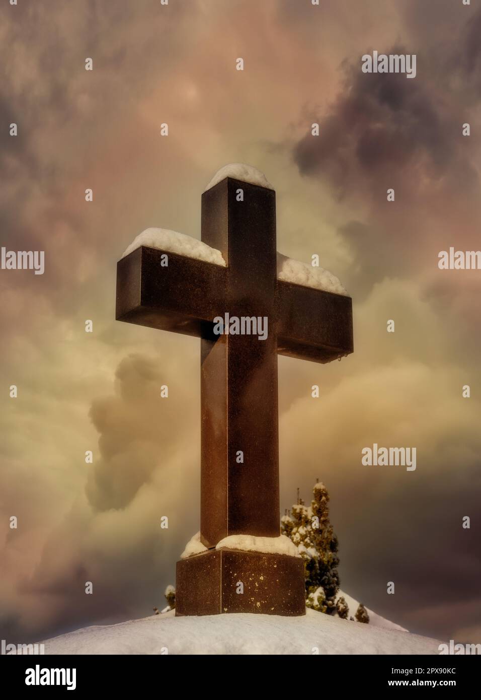 Snow covered historic crucifix in a cemetry Stock Photo - Alamy